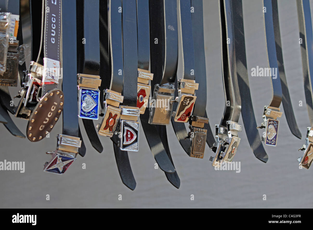 Belts on display Stand outside a shop, India Stock Photo - Alamy