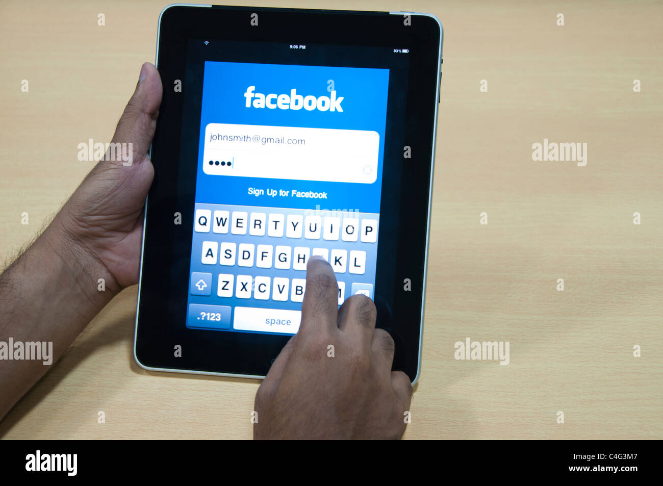 Browsing Facebook on iPad Stock Photo - Alamy