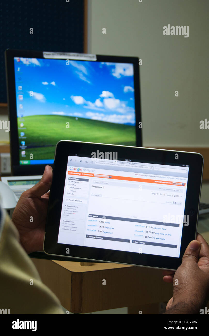Man using iPad in office Stock Photo - Alamy