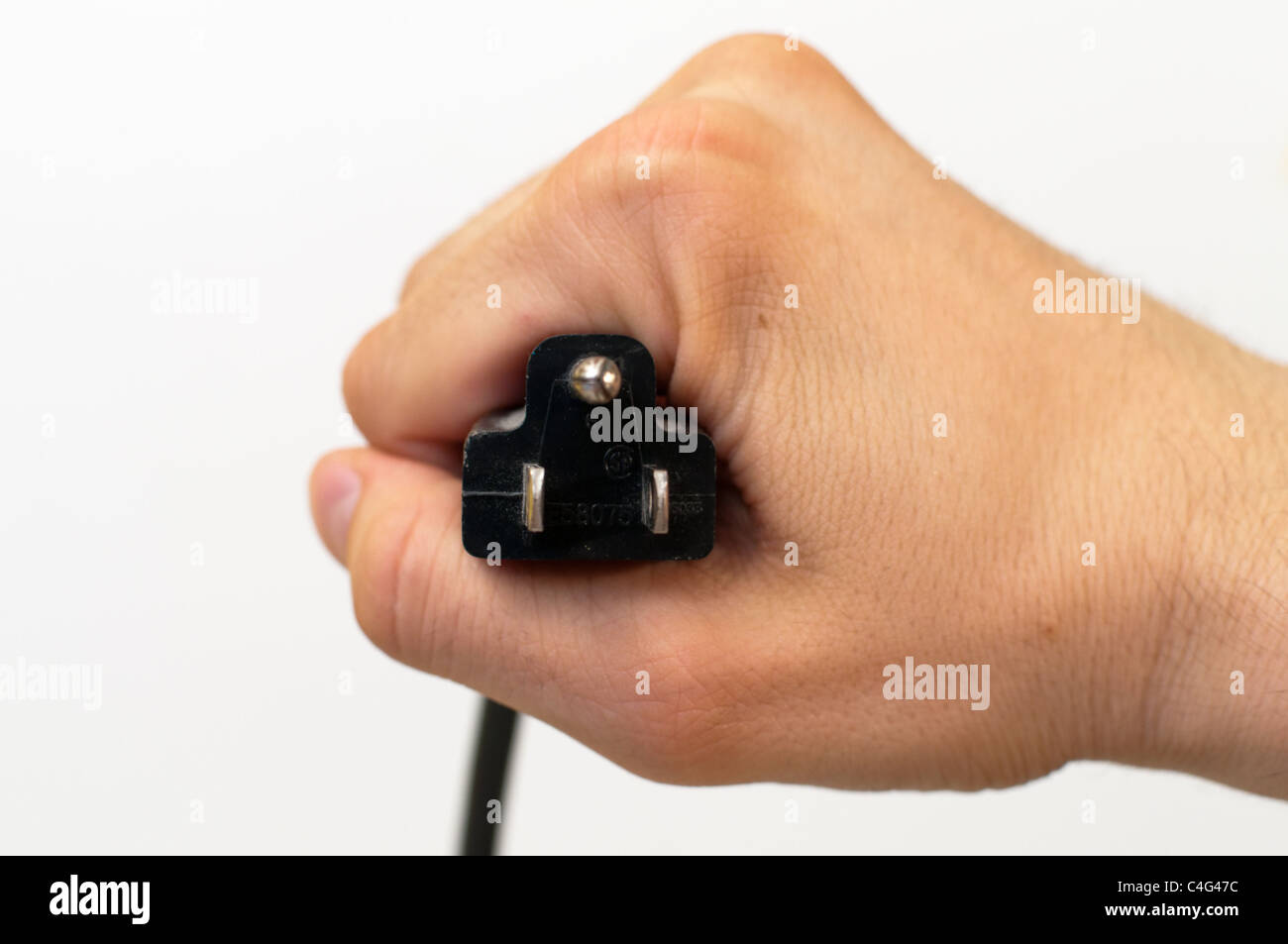Hand holding an electrical cord Stock Photo - Alamy