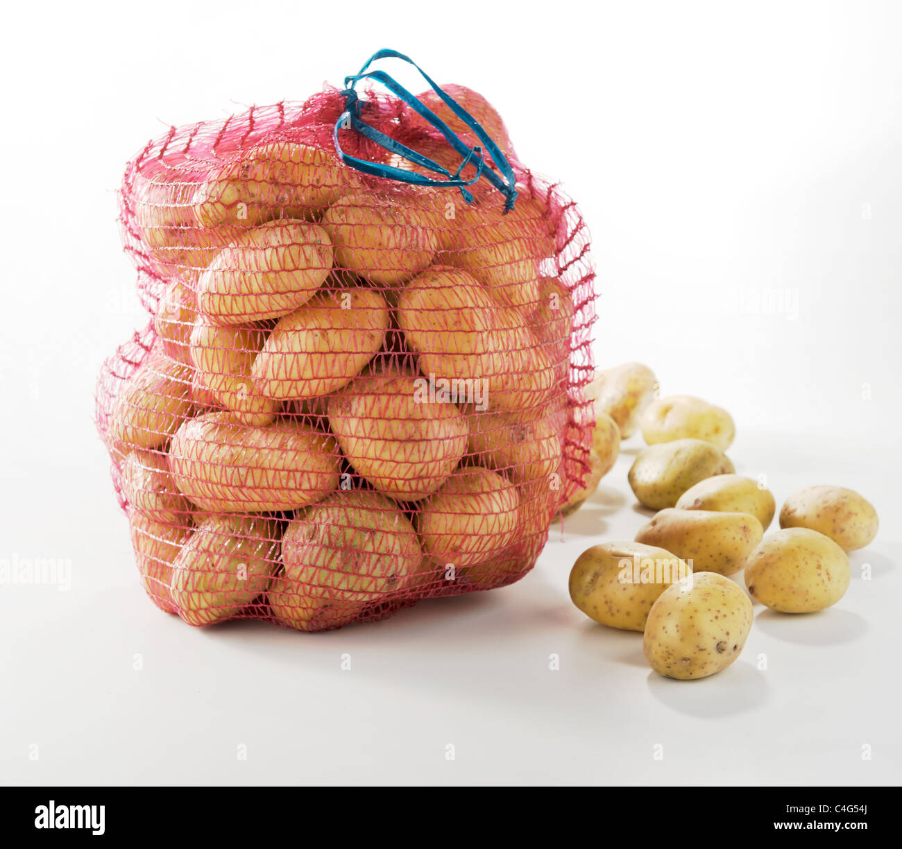 Sack of fresh potatoes on white background Stock Photo - Alamy