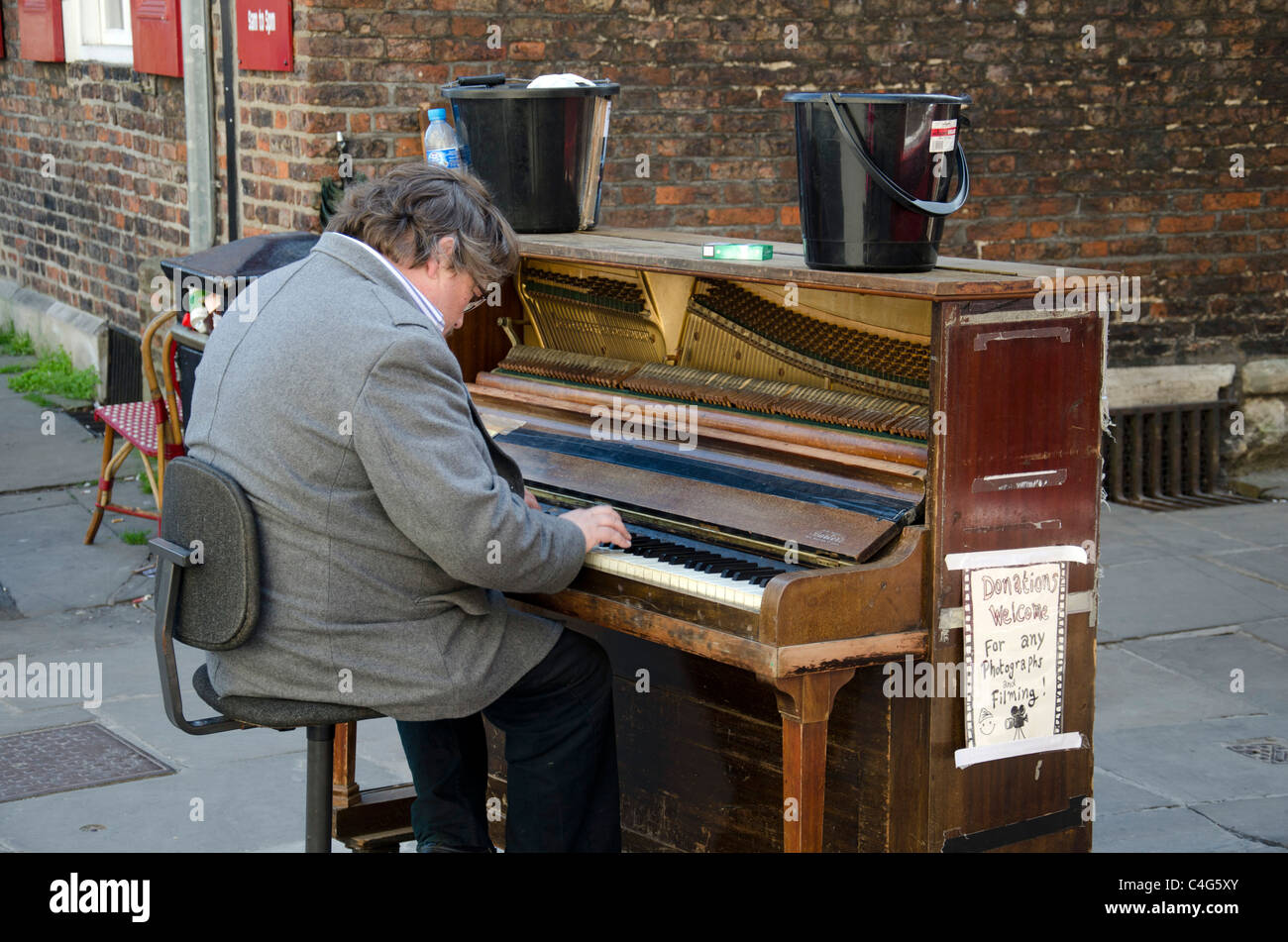 Piano-playing busker in York City Centre, England Stock Photo - Alamy