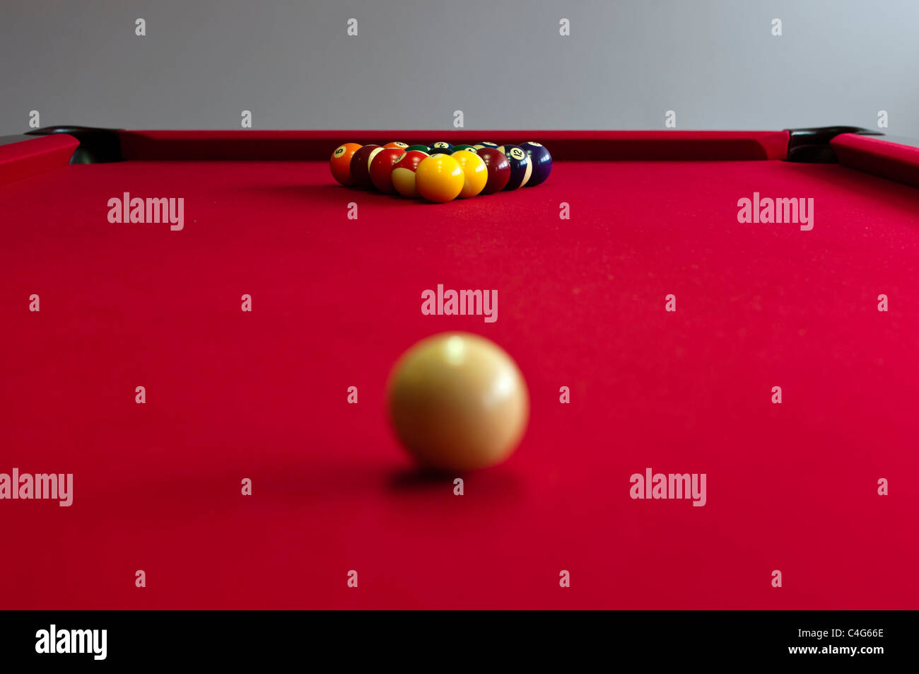 Balls on a red pool table Stock Photo - Alamy