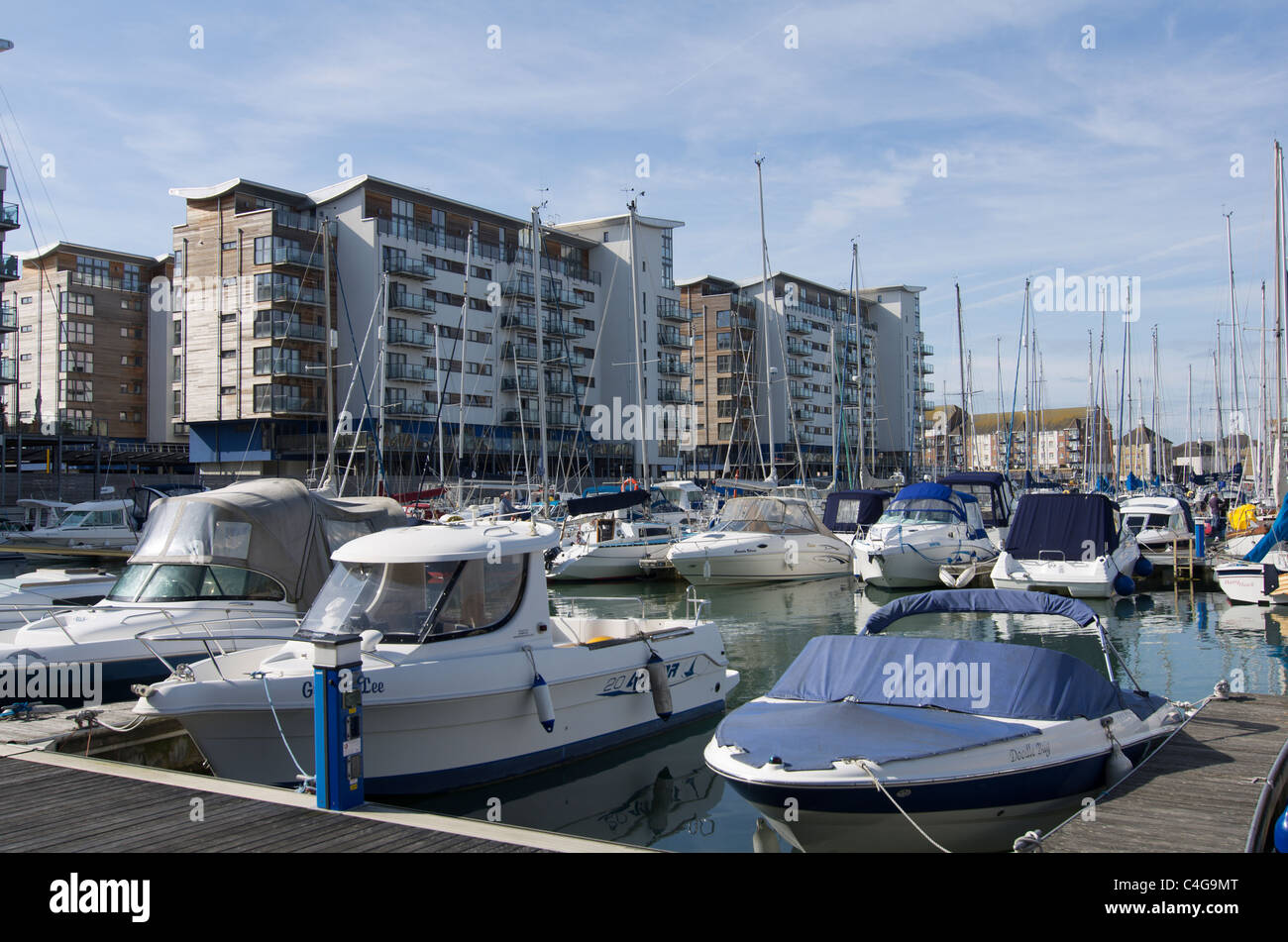 busy marina full of boats and yachts at Sovereign Harbour, Eastbourne ...