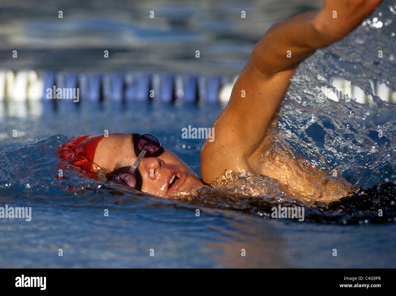Female swimming the freestyle Stock Photo - Alamy