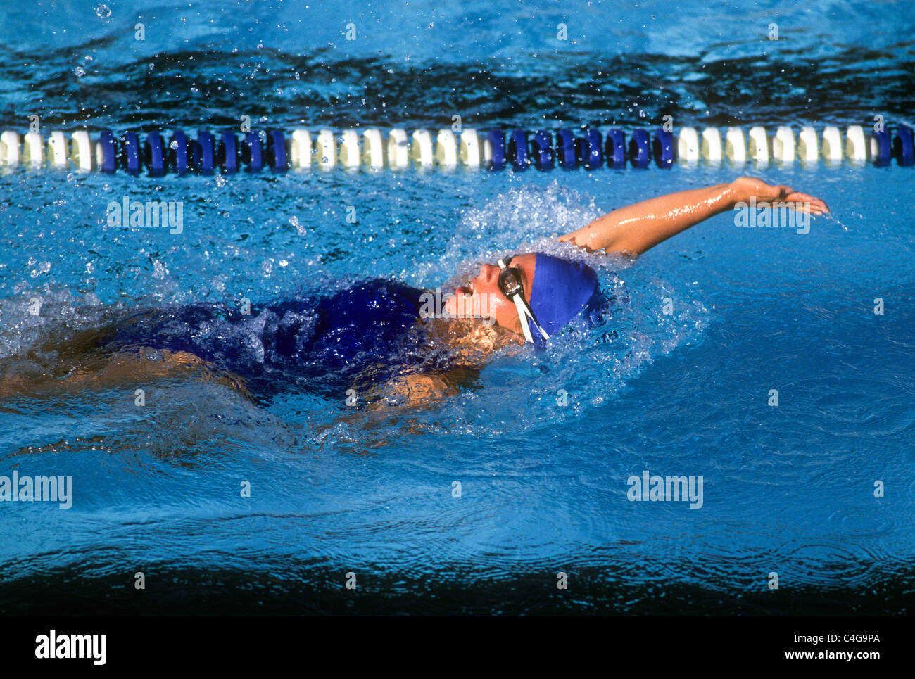 Female swimmer doing the backstroke Stock Photo - Alamy