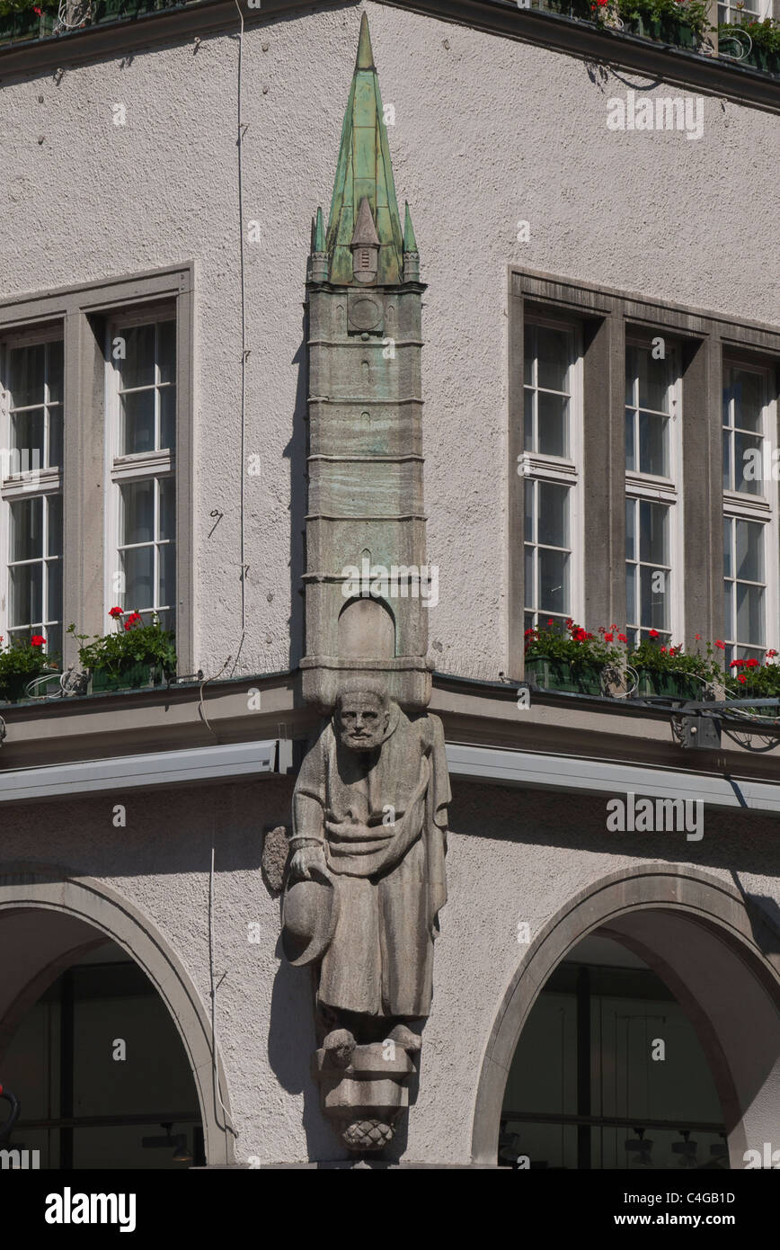 Well dressed man on the roof top of a giant building is dwarfed by the ...