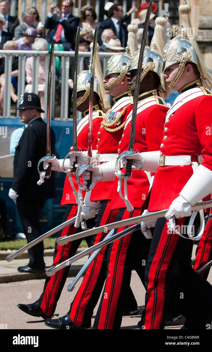 Soldiers marching in a procession ahead of The Queen to attend the ...