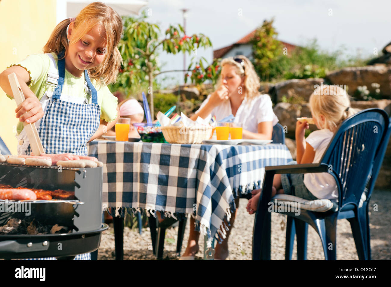 Family Having Barbecue High Resolution Stock Photography and Images - Alamy