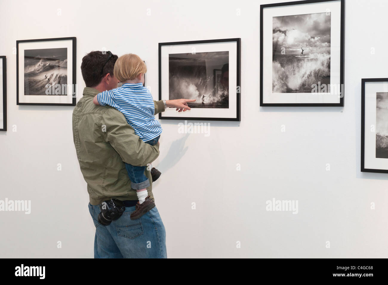 Father and son viewing the Ed Freeman Photography Gallery opening of ...