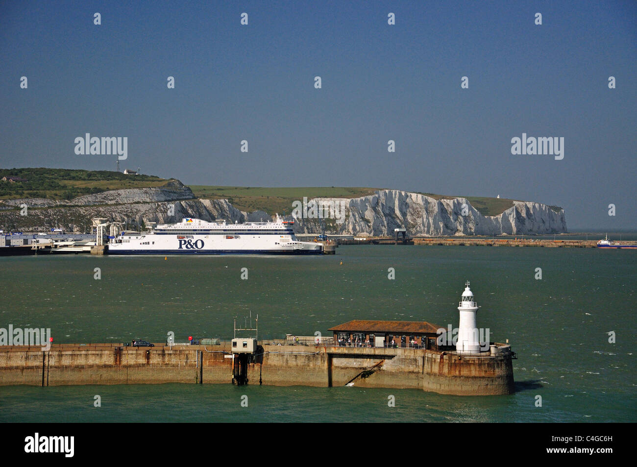 The White Cliffs of Dover and lighthouse from sea, Dover, Kent, England ...