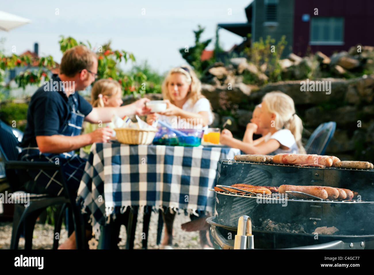 Family Having Barbecue High Resolution Stock Photography and Images - Alamy