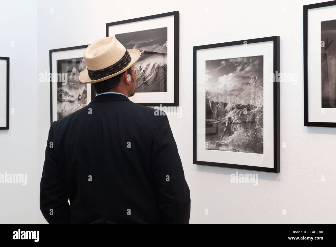 Man viewing theEd Freeman Photography Gallery opening of his new ...