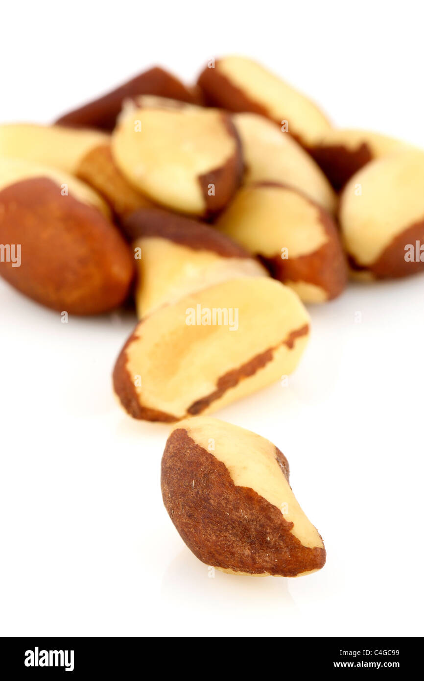 fresh organic brazil nuts on white background shallow D.O.F Stock Photo ...