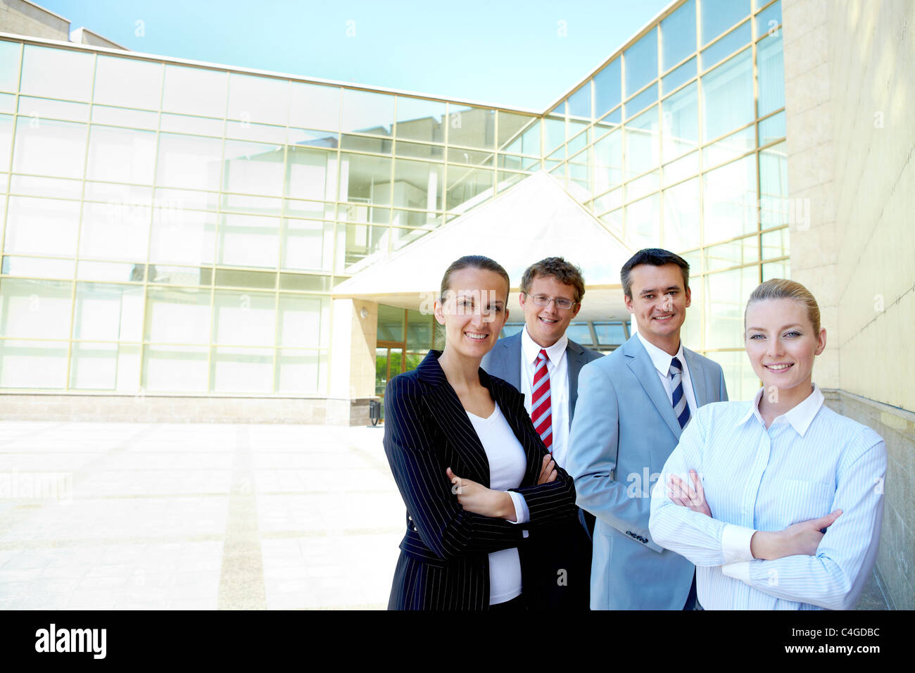 Portrait of friendly partners looking at camera outside Stock Photo - Alamy
