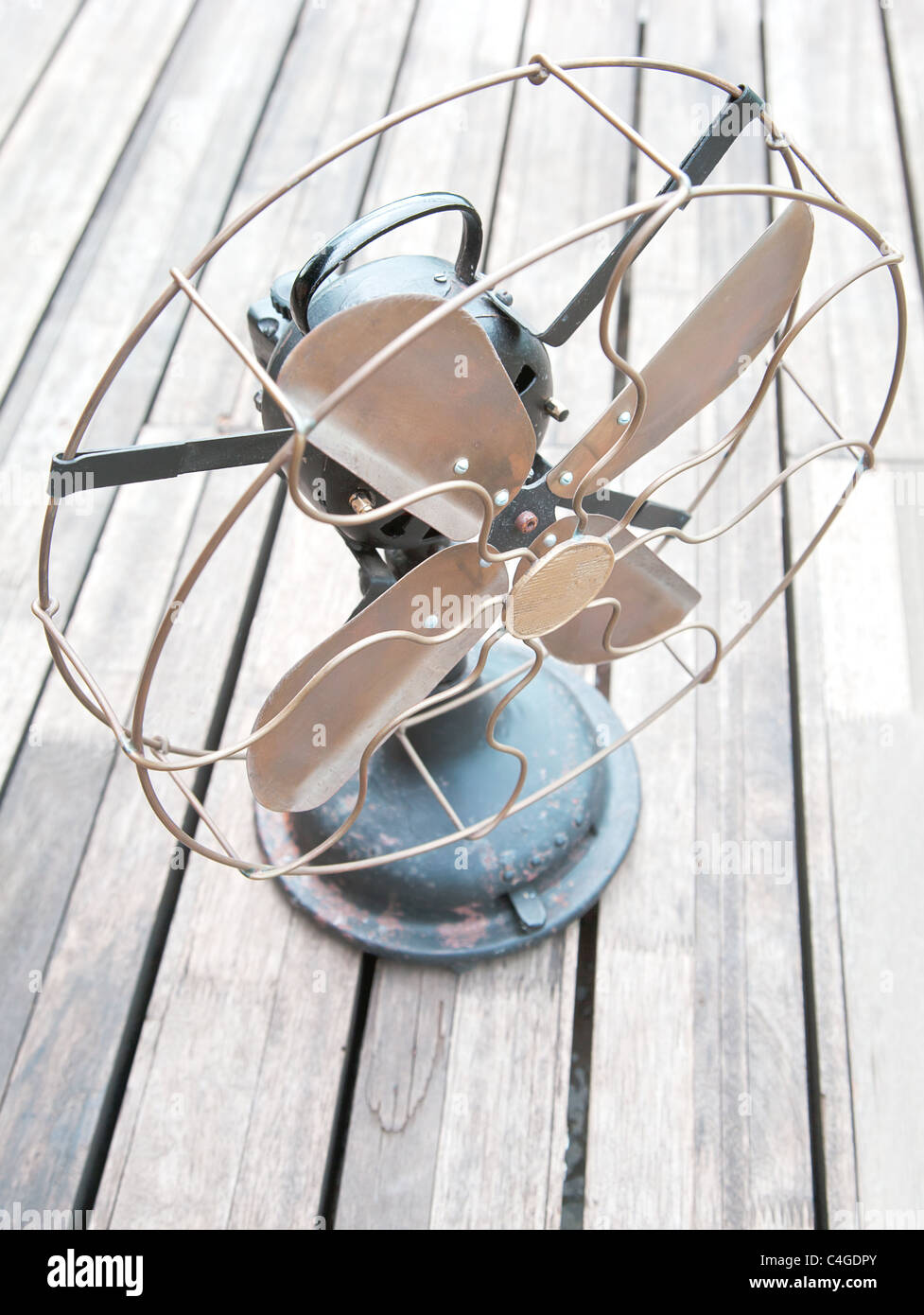 old cooler fan on wood slat decking Stock Photo - Alamy