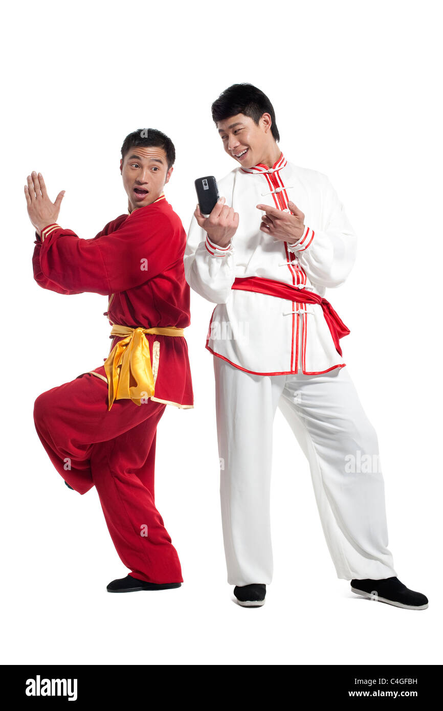 Two people showing phone Cut Out Stock Images & Pictures - Alamy