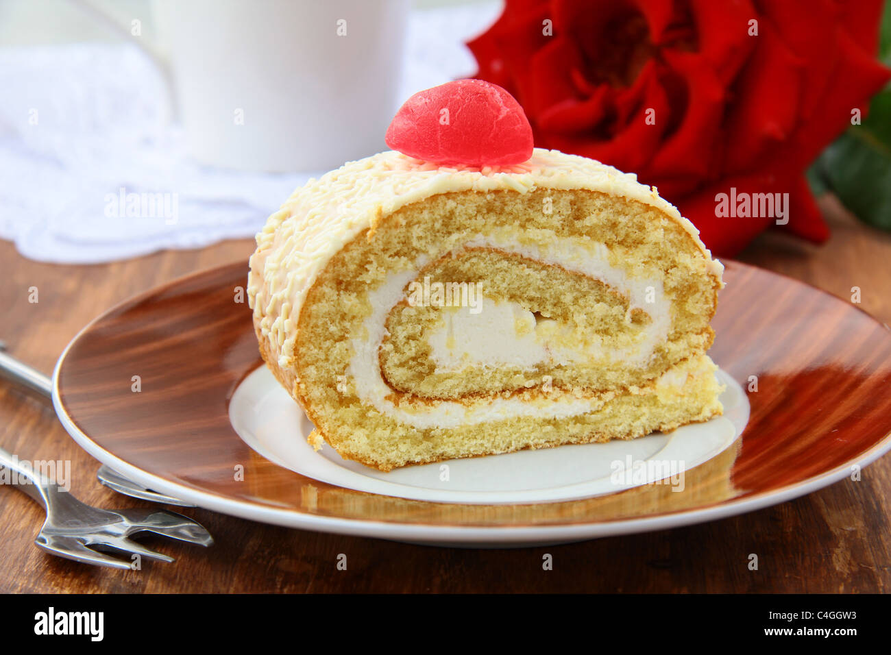 biscuit roulade with cream and white chocolate Stock Photo - Alamy