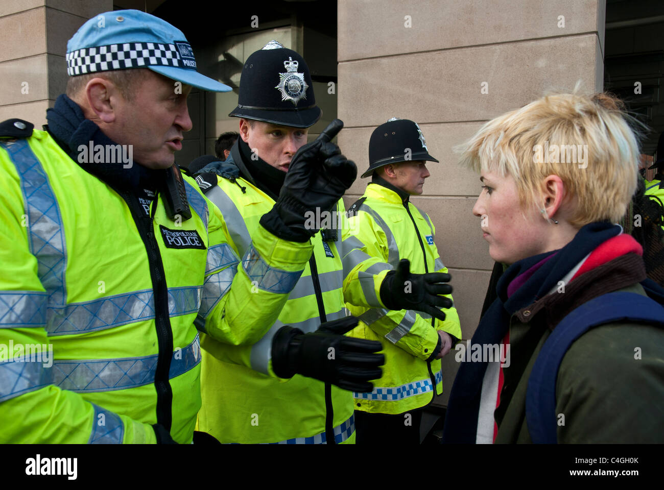 TWO POLICE OFICERS IRATELY ARGUING WITH THE PROTESTER Stock Photo - Alamy
