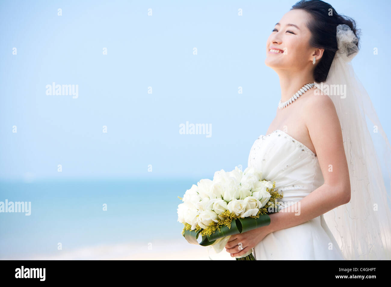Portrait smiling woman eyes closed relaxing on the beach hi-res stock ...