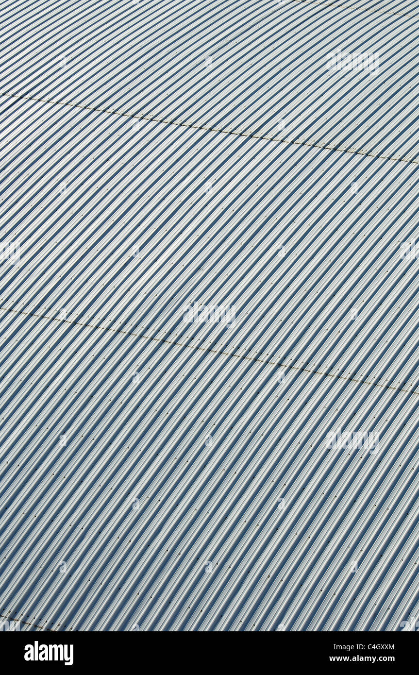 abstract background created by the surface of a metal roof industrial ...