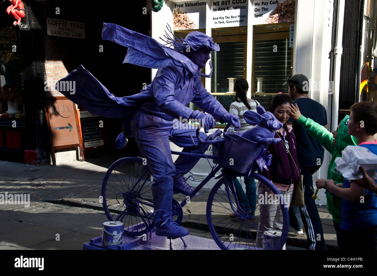 "Human statue" on a bicycle in York City Centre, England Stock Photo ...