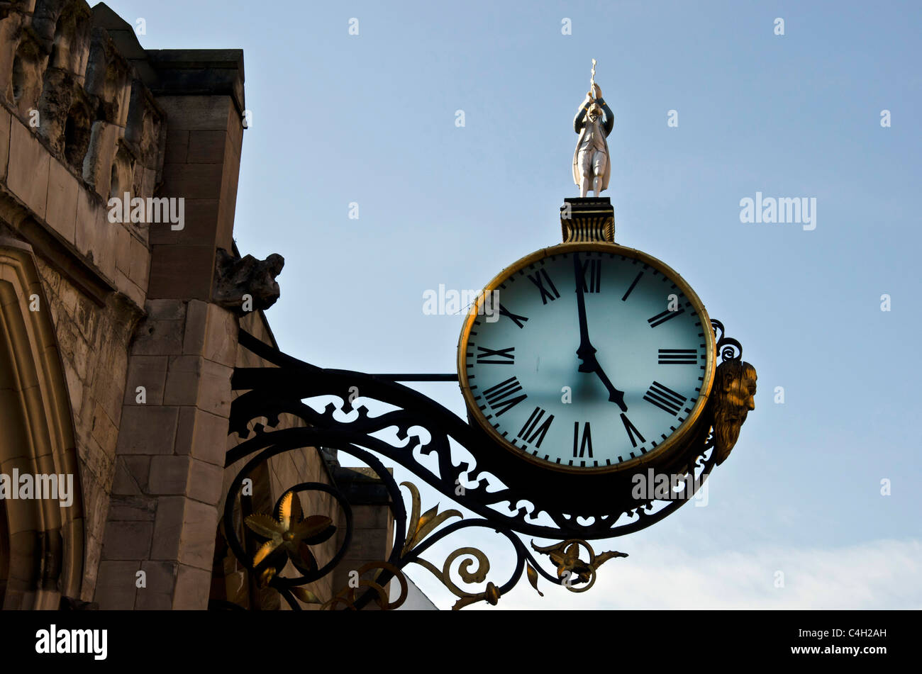 Clock mounred on a church wall in York City Centre, England Stock Photo ...