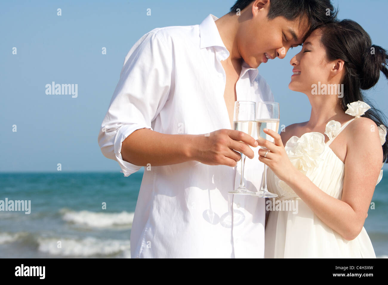 Chinese men celebrating on beach hi-res stock photography and images - Alamy