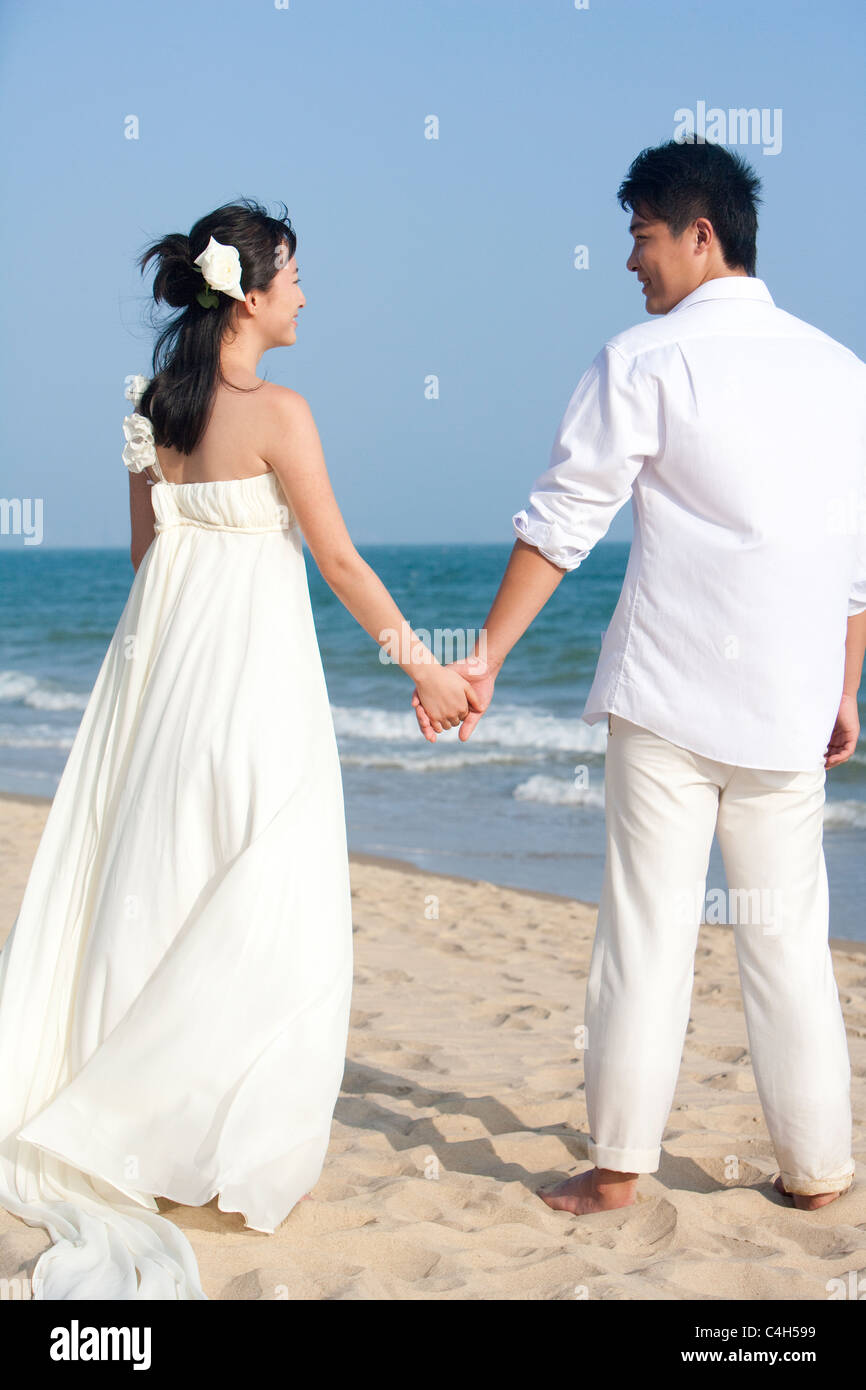 Happy Newlyweds on the Beach Stock Photo - Alamy