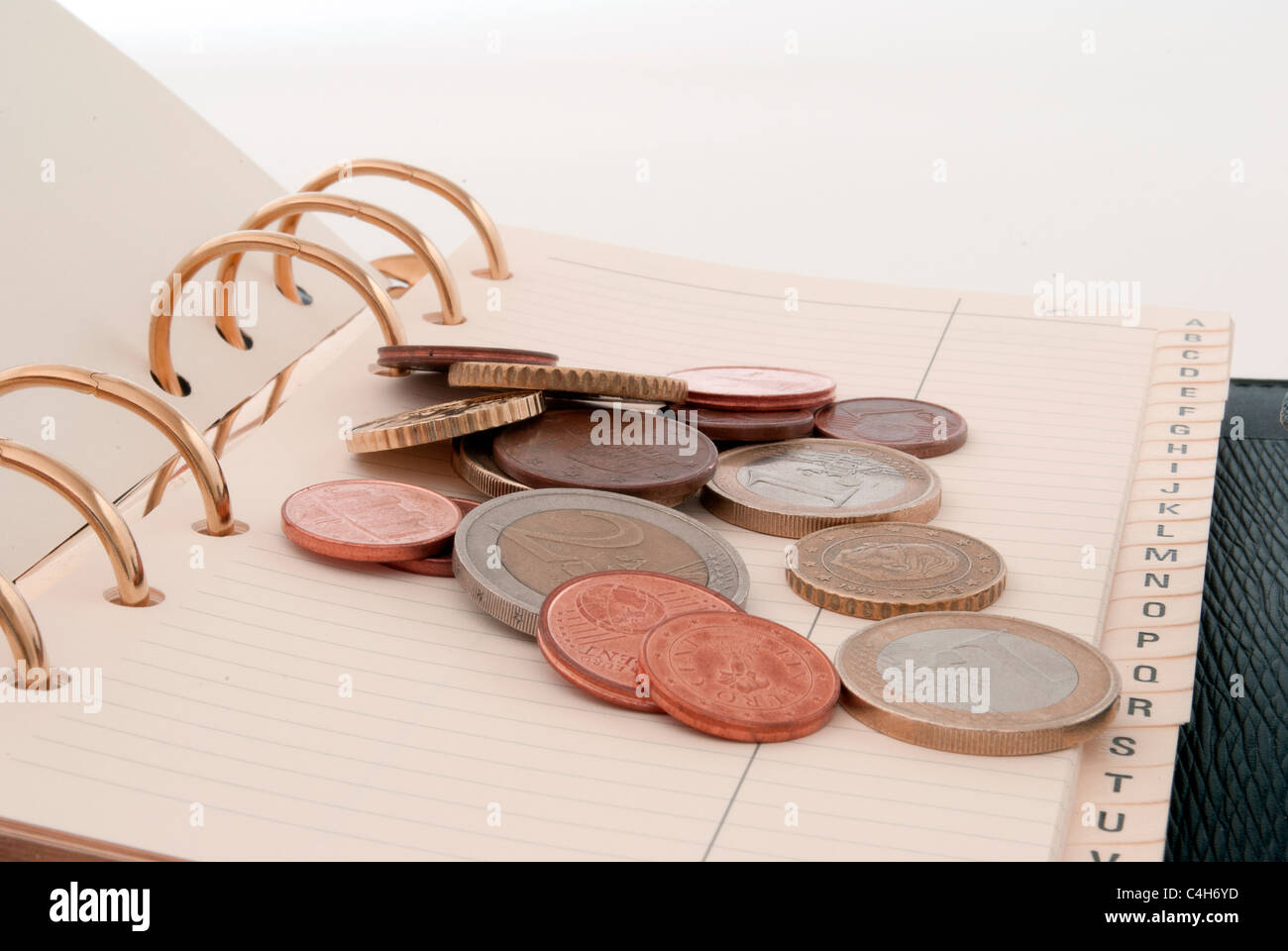 telephone book with euro coins Stock Photo - Alamy