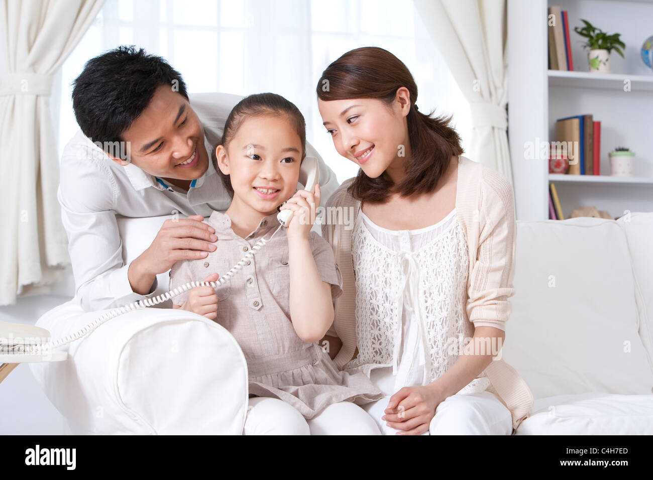 Happy Family On the Phone Stock Photo - Alamy