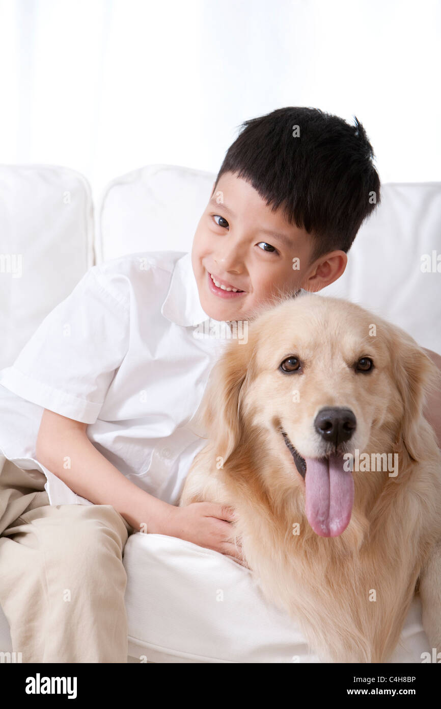 Young Boy Hugging Dog Stock Photo - Alamy