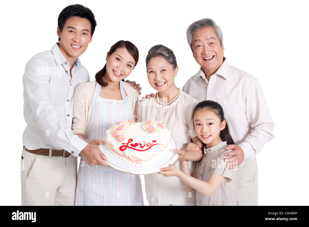 Happy Family Holding a Cake Stock Photo - Alamy