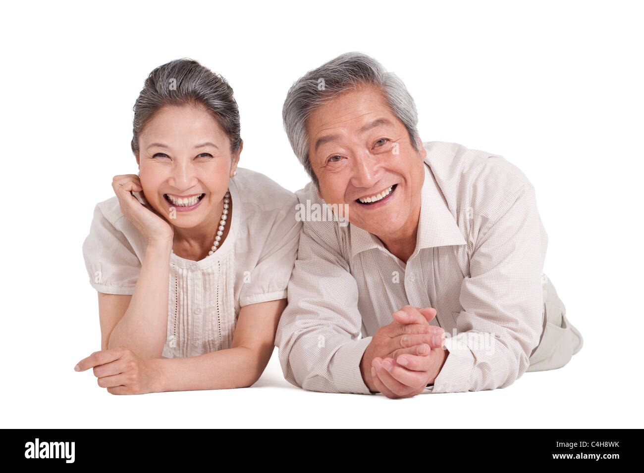 Senior Couple Laying on Front Stock Photo - Alamy
