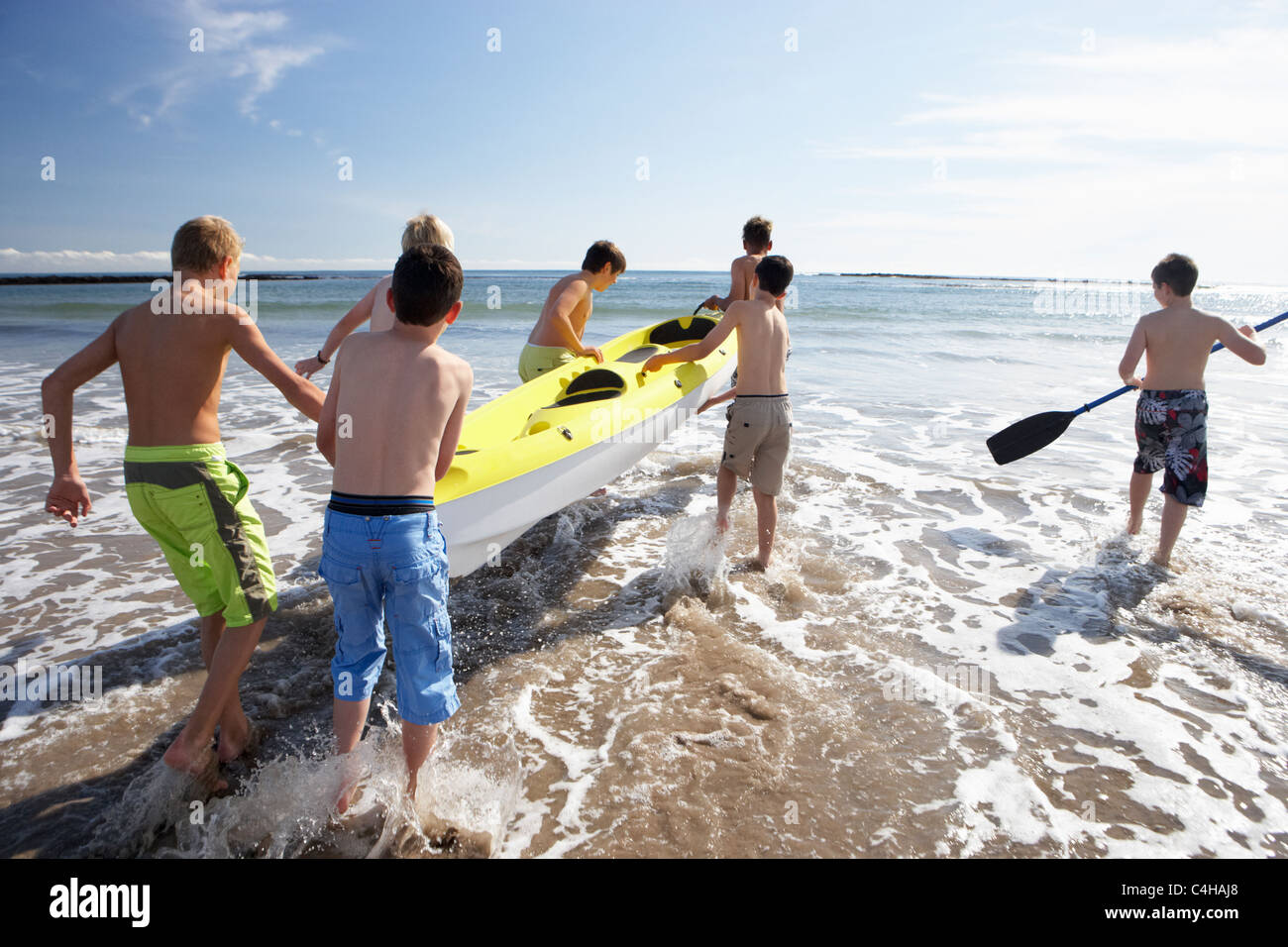 Teenage boys kayaking Stock Photo - Alamy