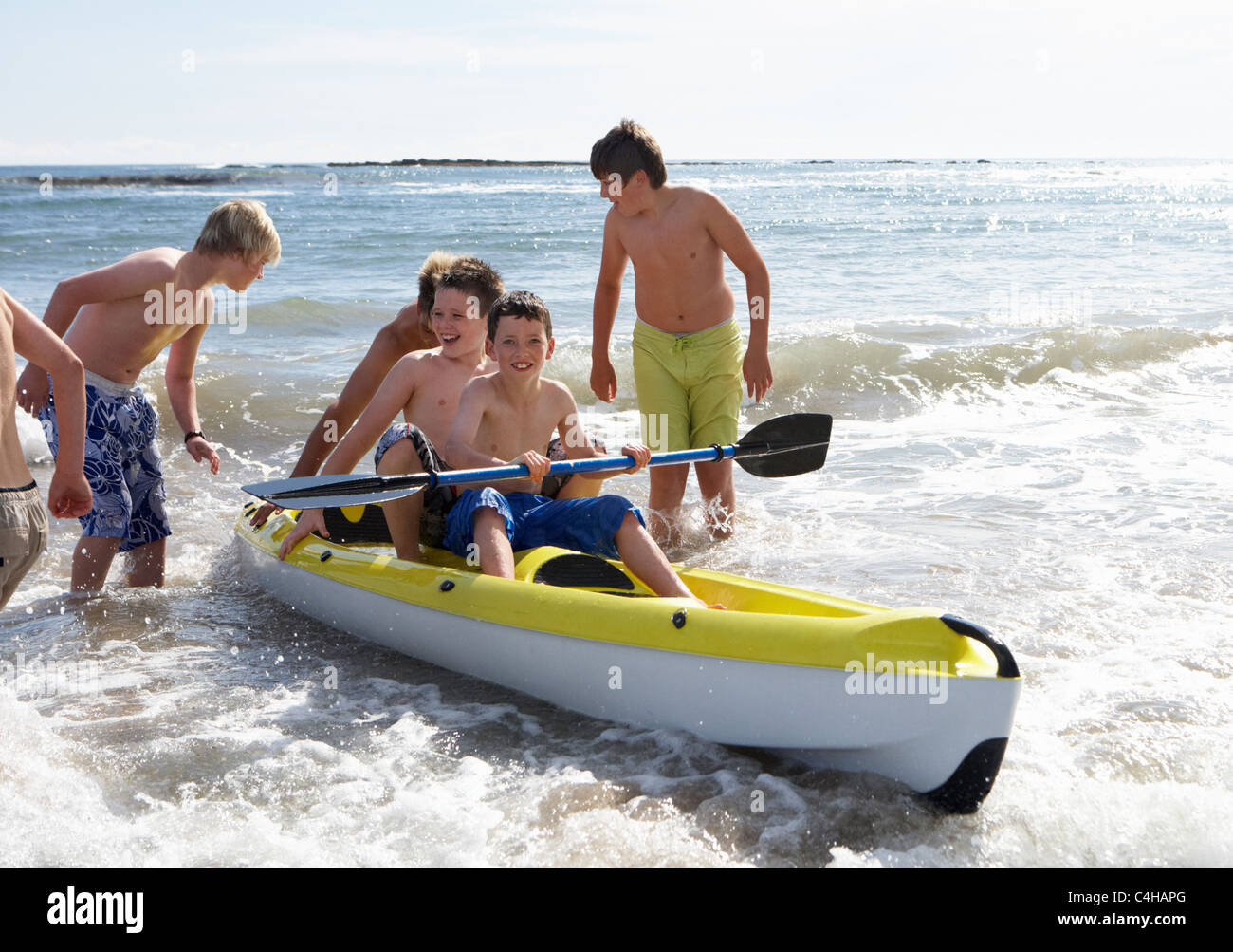 Teenage boys kayaking Stock Photo - Alamy