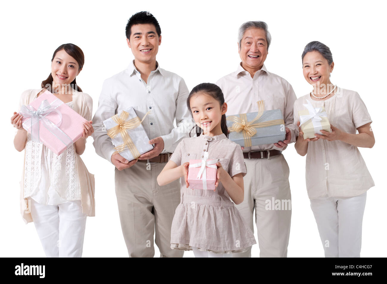Family Carrying Presents Stock Photo - Alamy