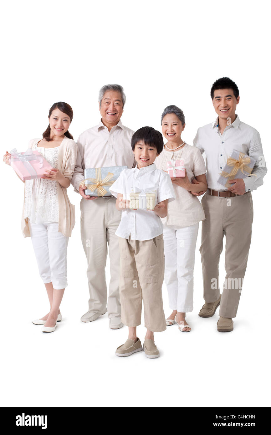 Family Carrying Presents Stock Photo - Alamy