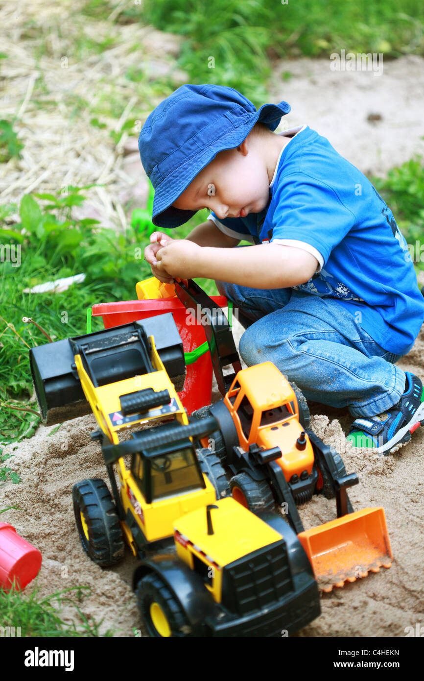 Boy playing with digger hi-res stock photography and images - Alamy