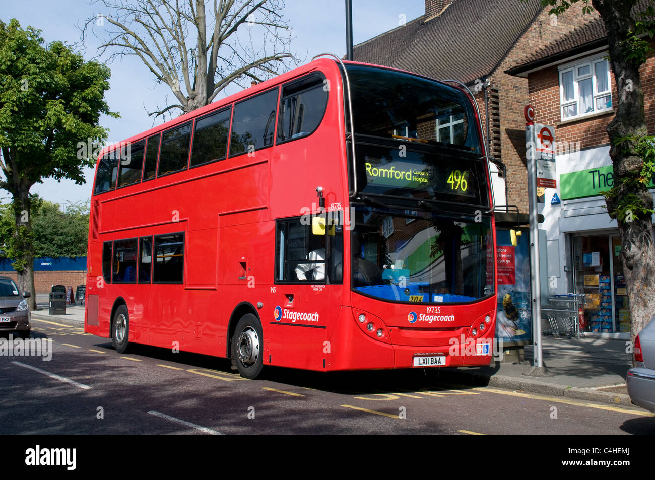 A new bus just a few weeks old waits at a bus stop before setting out ...