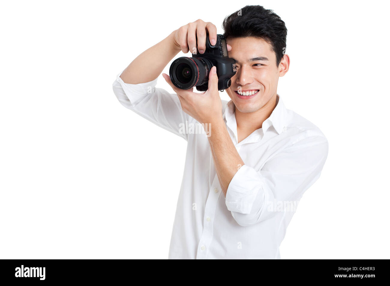 Young man taking photos Stock Photo - Alamy