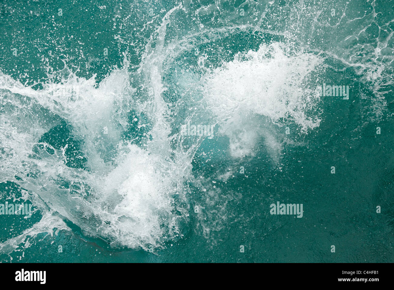 two divers splashes in tropical blue sea Stock Photo - Alamy