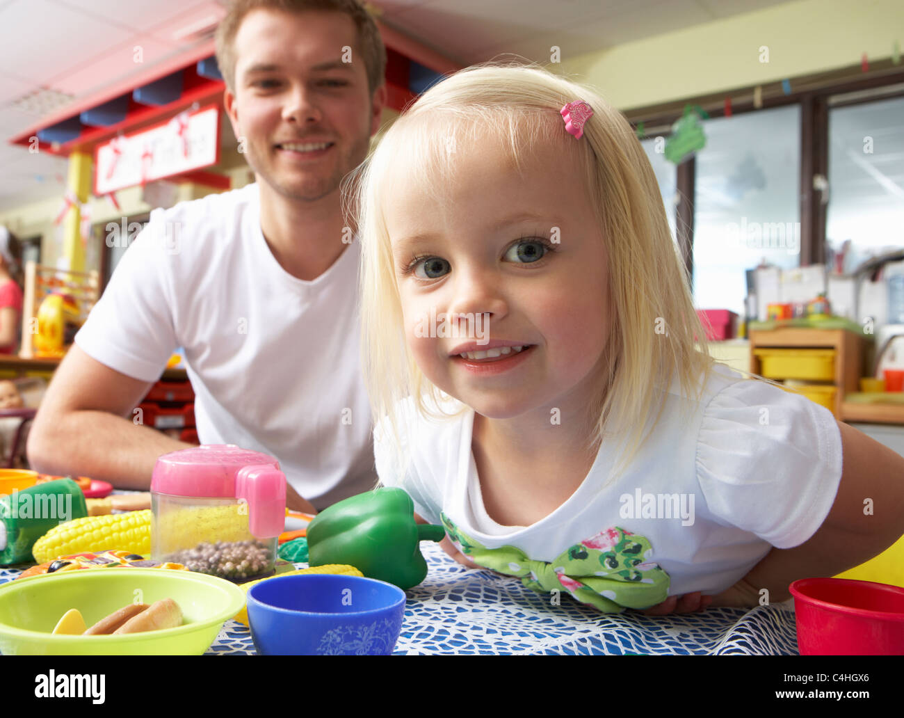 Man with children playing together Stock Photo - Alamy