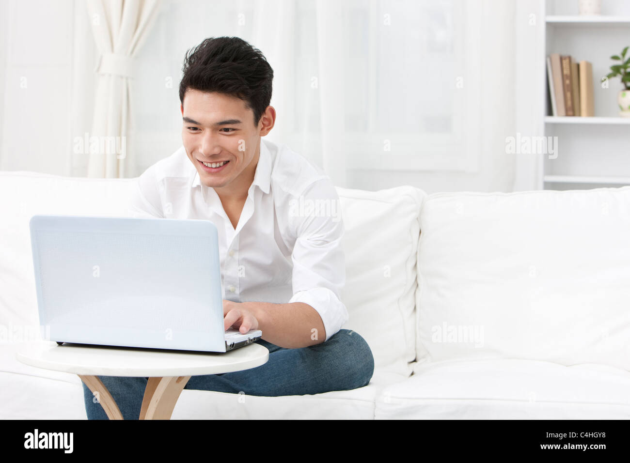 Man jeans laptop one person desk hi-res stock photography and images - Alamy