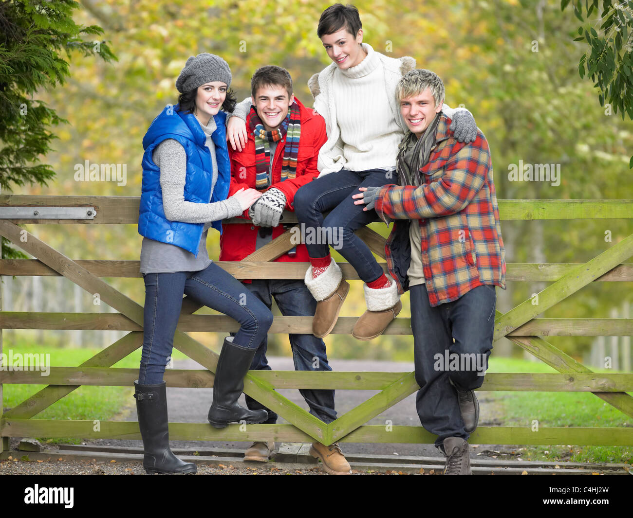 Friends sitting on fence hi-res stock photography and images - Alamy