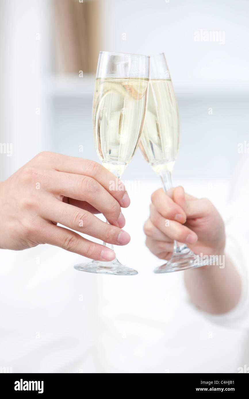 Champagne flutes toasting Stock Photo - Alamy