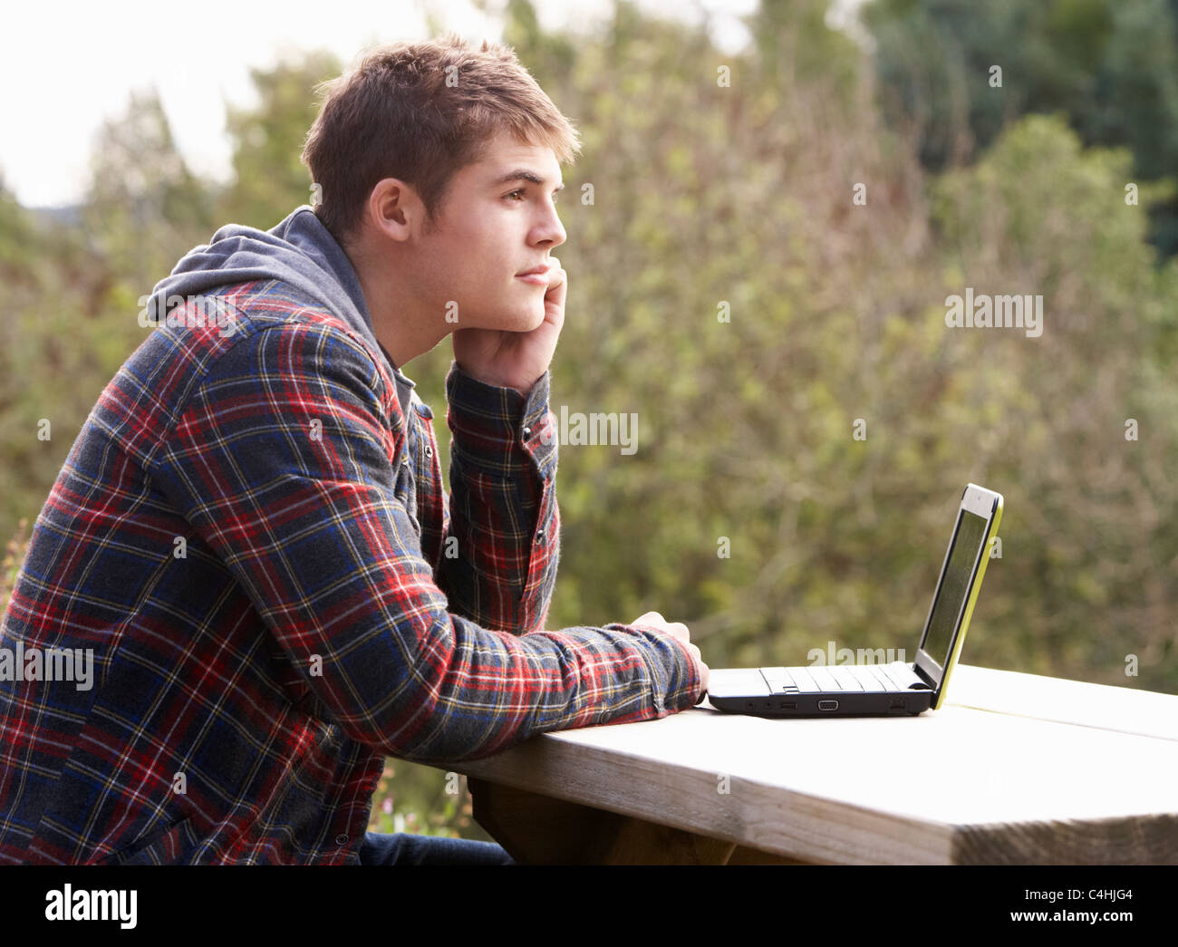 Young man with laptop computer Stock Photo - Alamy