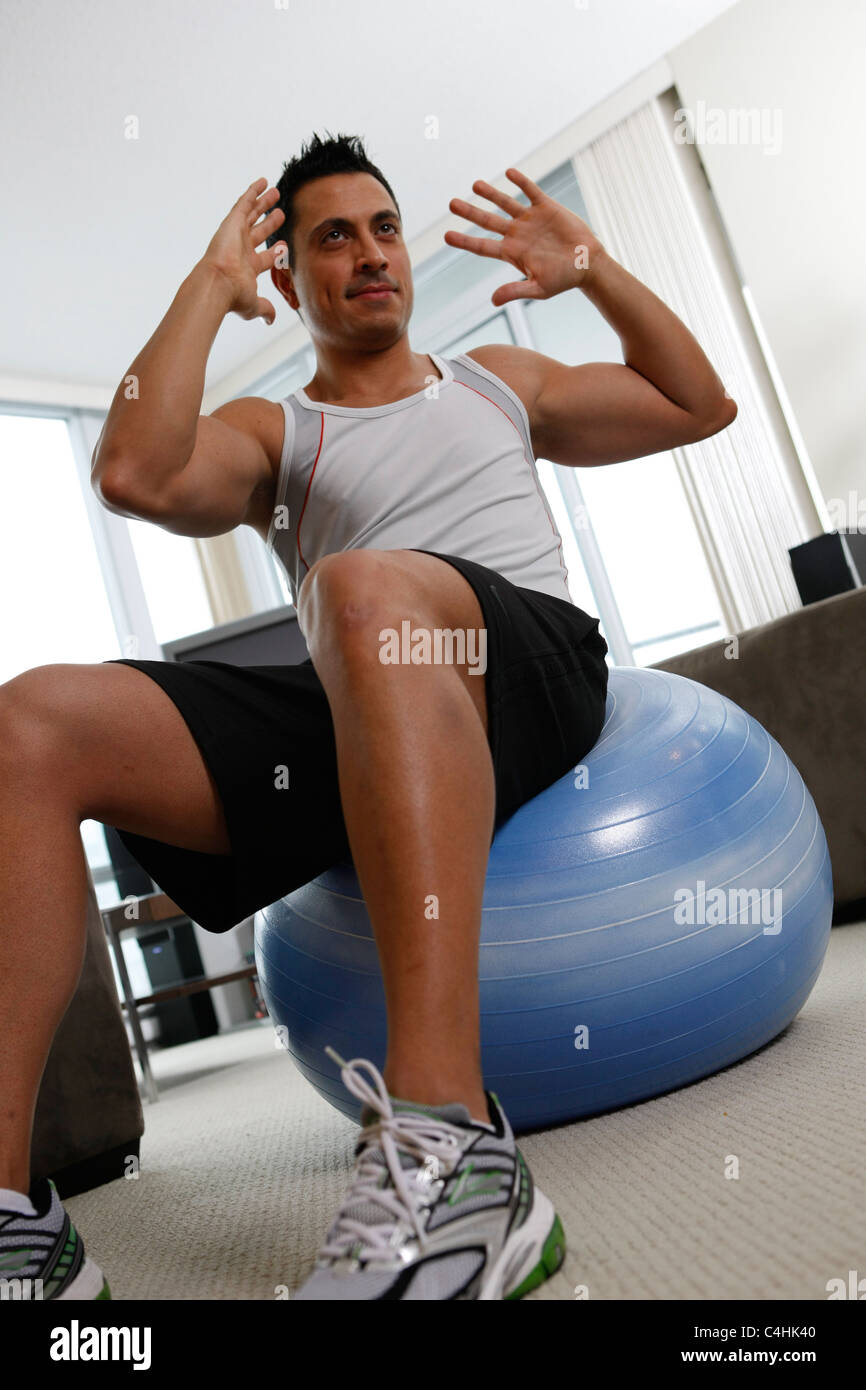 Fit guy working out at home Stock Photo - Alamy