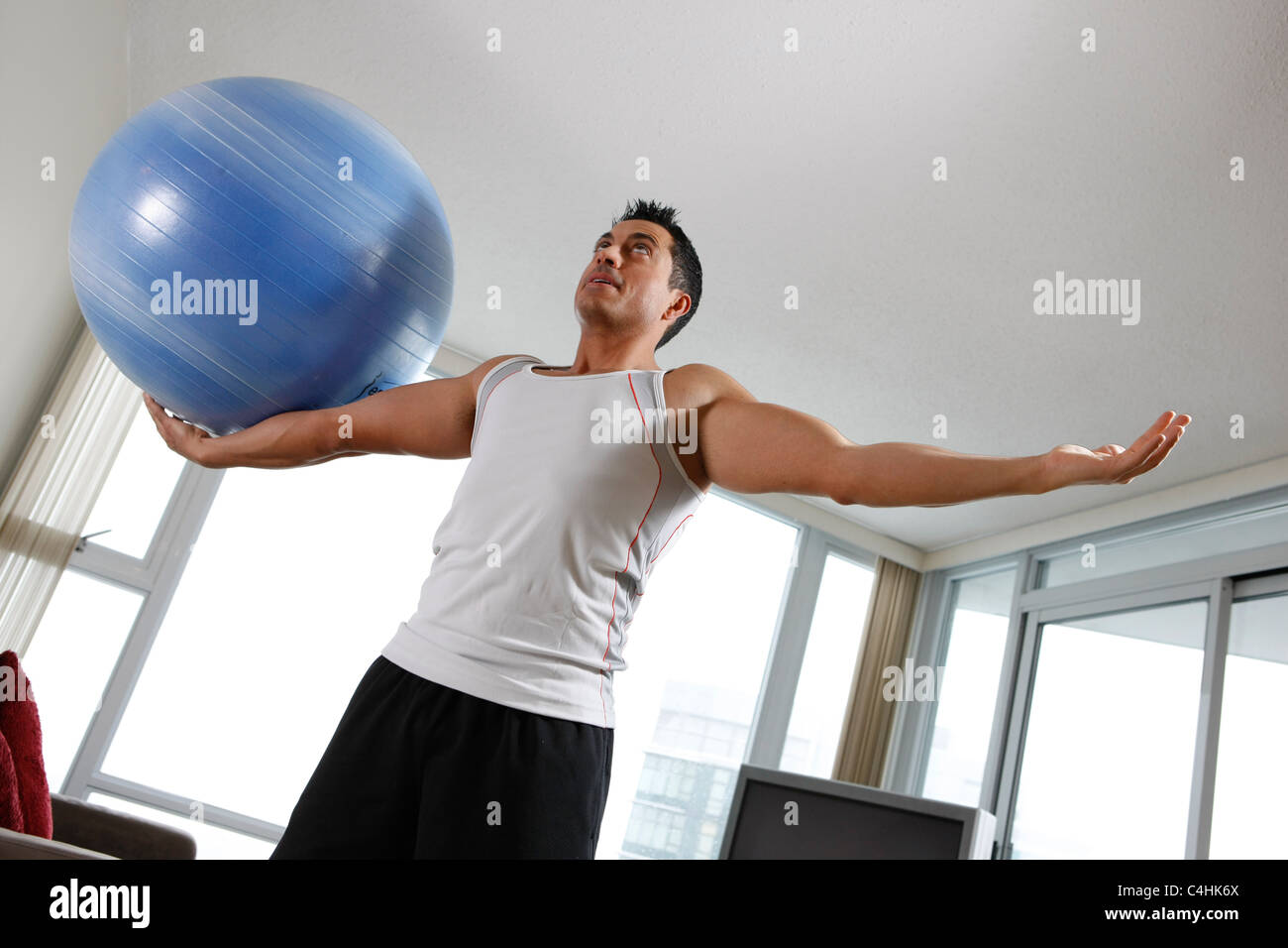 Fit guy working out at home Stock Photo - Alamy