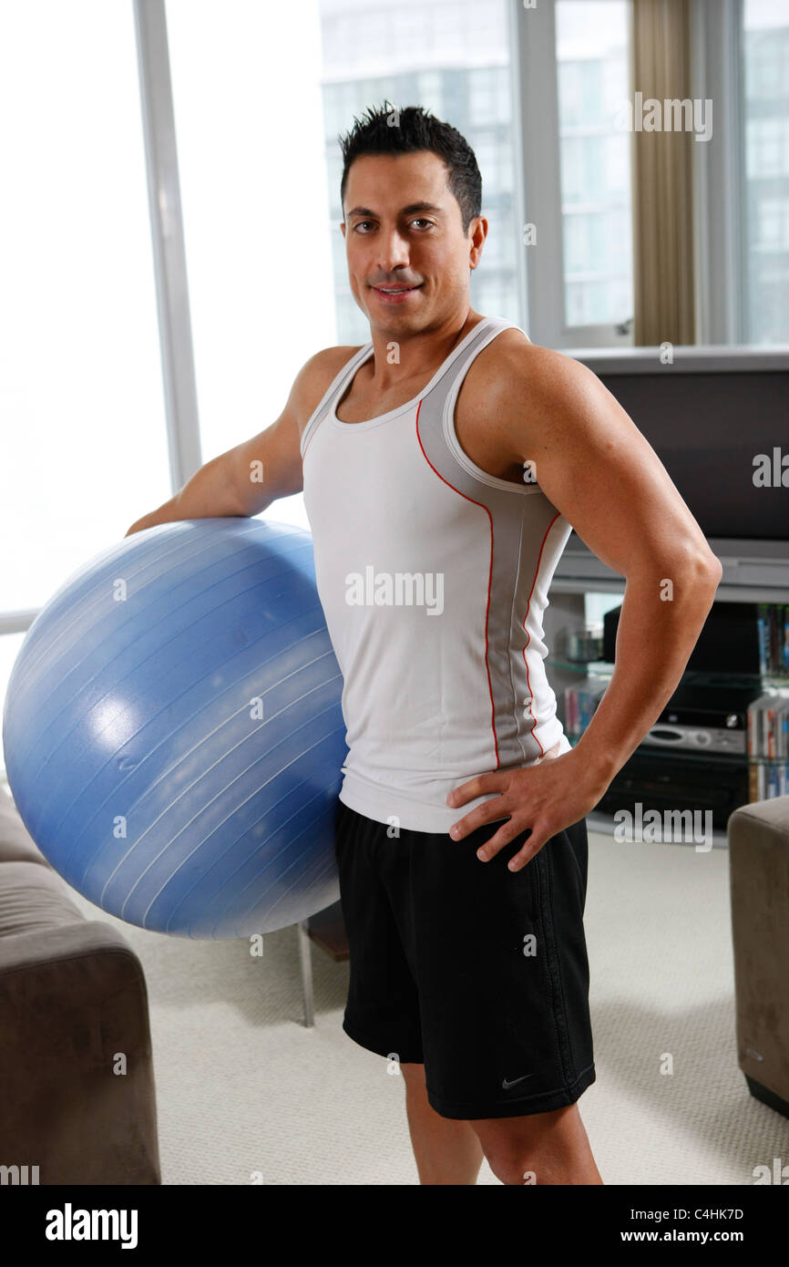 Fit guy working out at home Stock Photo - Alamy